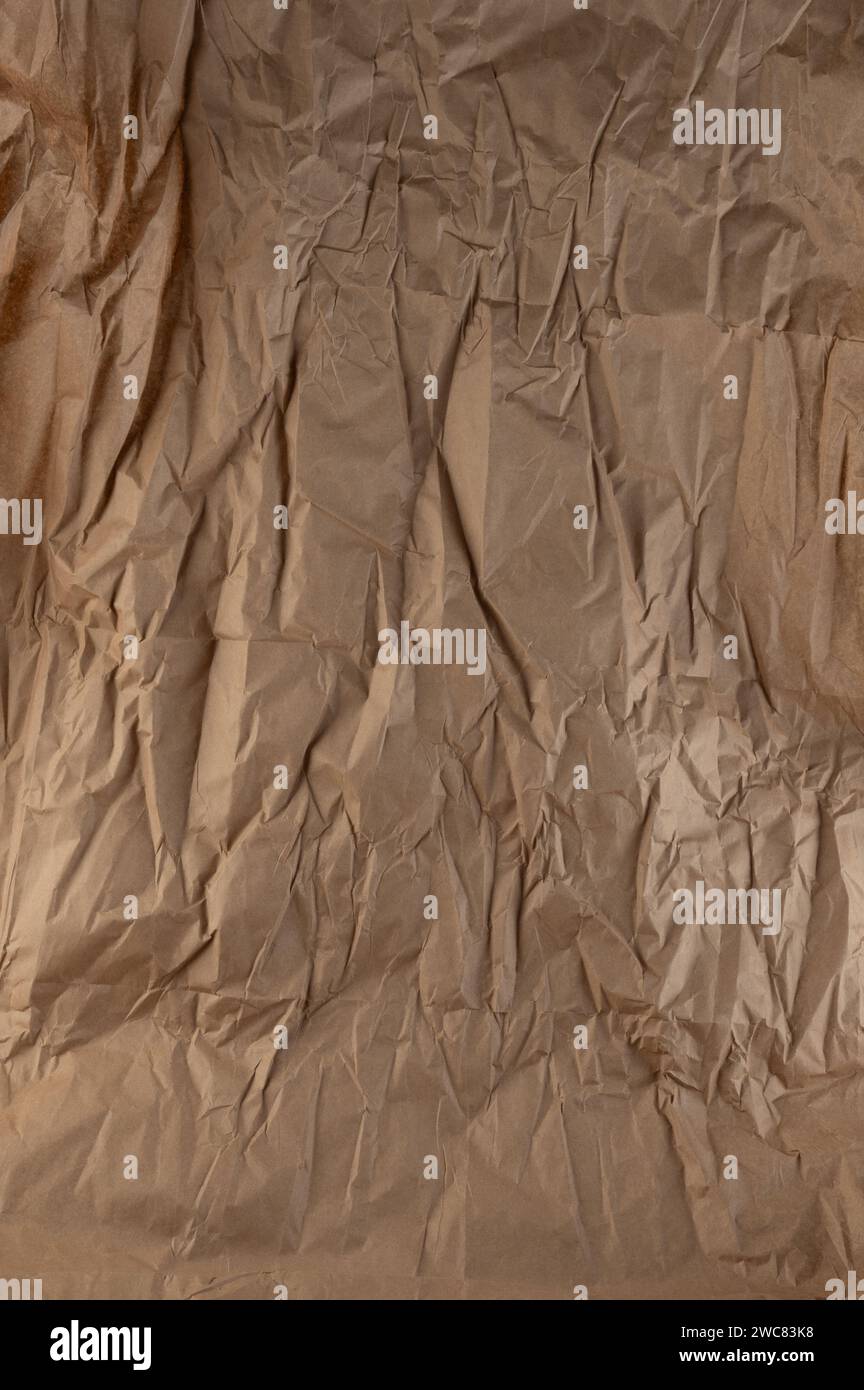 Crumpled beige color paper with fold lines flat view Stock Photo - Alamy