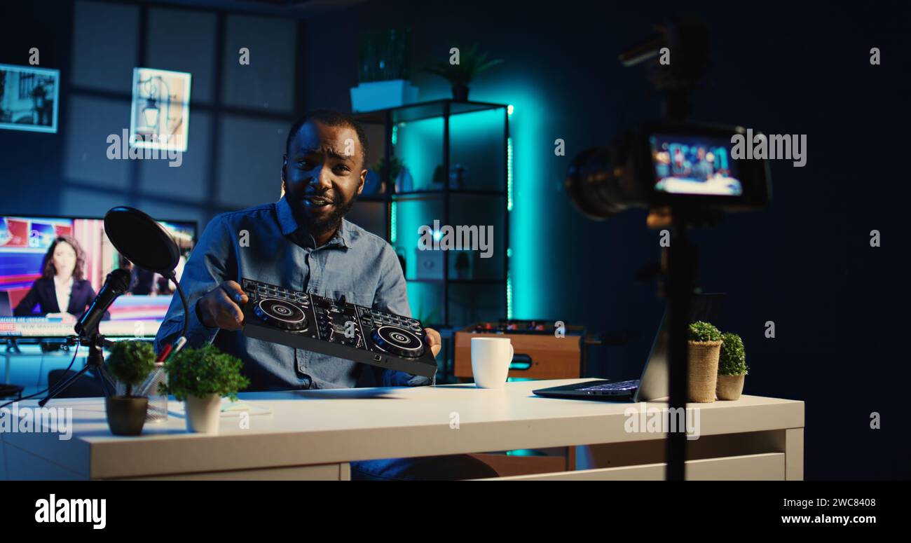 Content creator filming technology review of newly released high tech ...