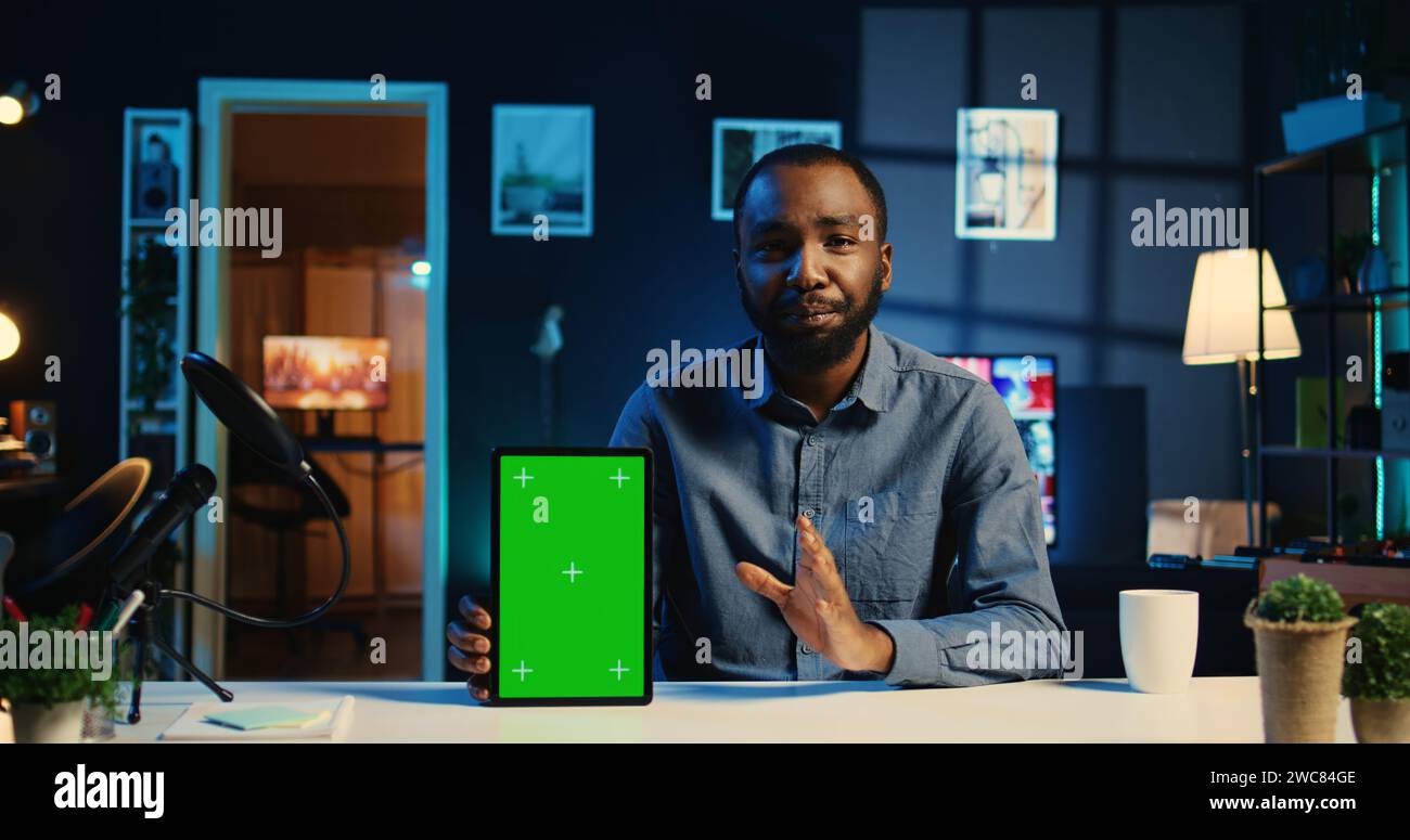 Tech online star filming chroma key tablet unboxing, giving reasons to purchase. Influencer ...
