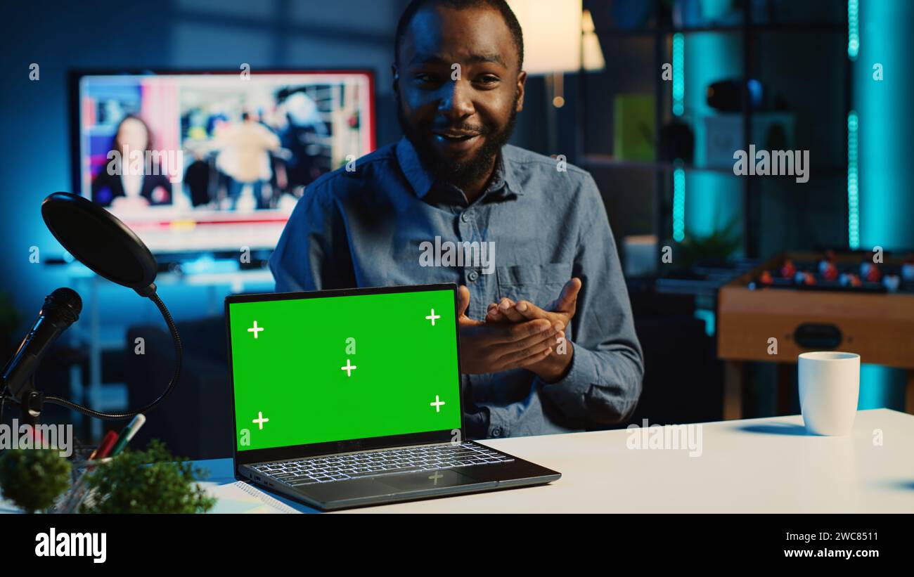 Content creator in studio films newly released chroma key gaming laptop ...