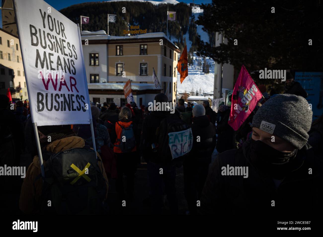 Davos, Switzerland. 14th Jan, 2024. Protesters march on street during a ...
