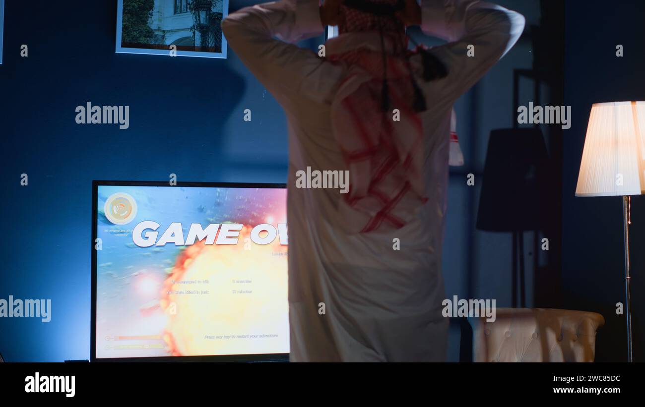 Gamer upset at seeing game over message on TV screen playing arcade ...