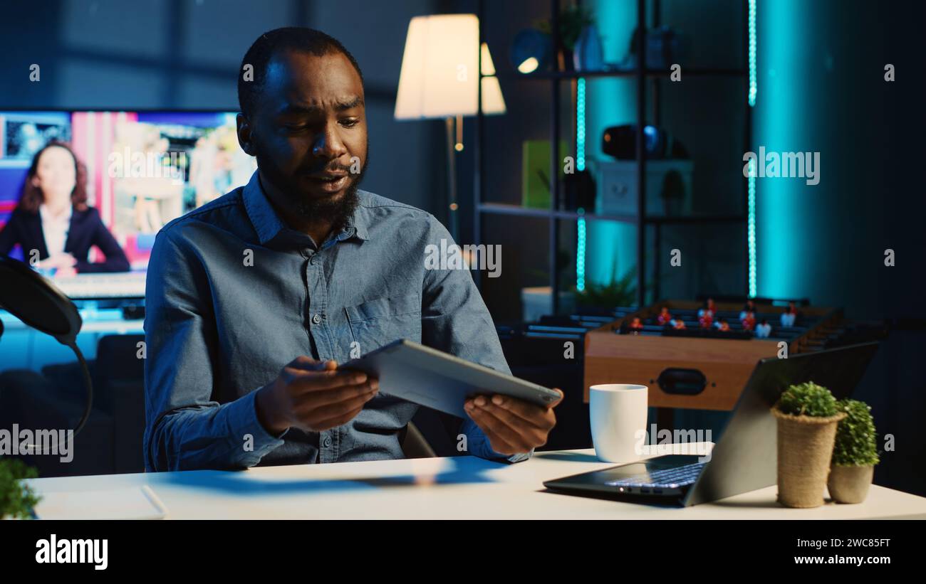 African american content creator filming technology review of newly ...