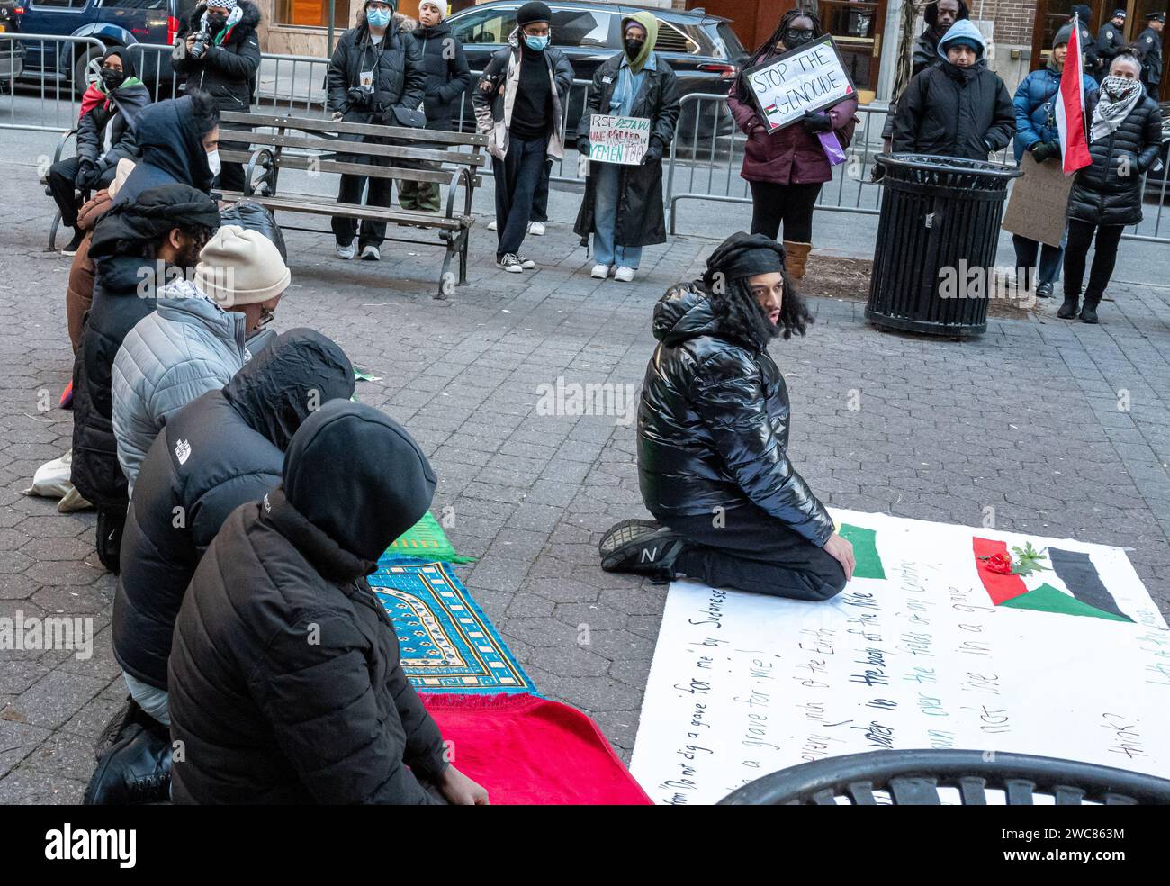 New York, New York, USA. 15th Jan, 2023. Demonstrators take a moment ...