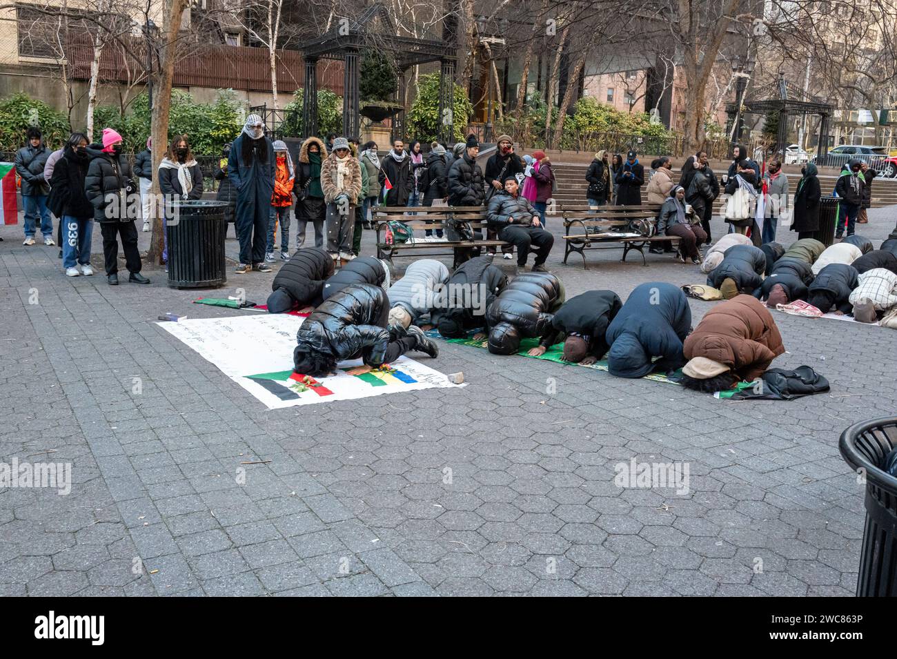 New York, New York, USA. 15th Jan, 2023. Demonstrators take a moment ...