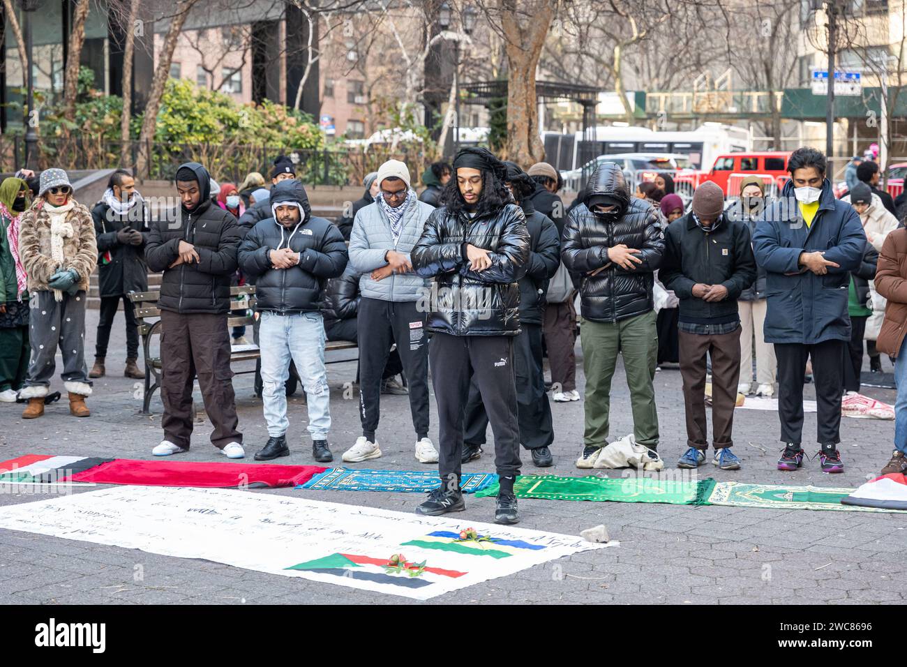 New York, New York, USA. 14th Jan, 2024. Demonstrators take a moment ...