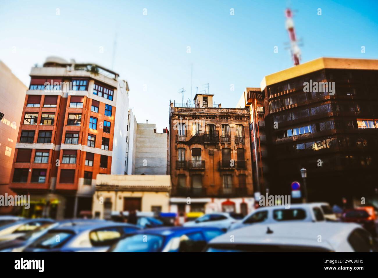 A mix of different architectural styles on a city street. An old ...