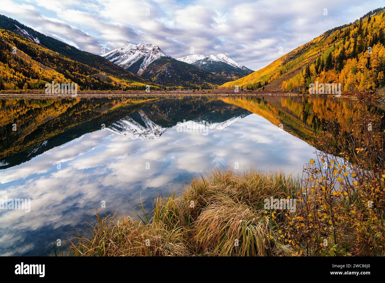 Snow capped mountains reflected in Crystal Lake outside Ouray, Colorado ...