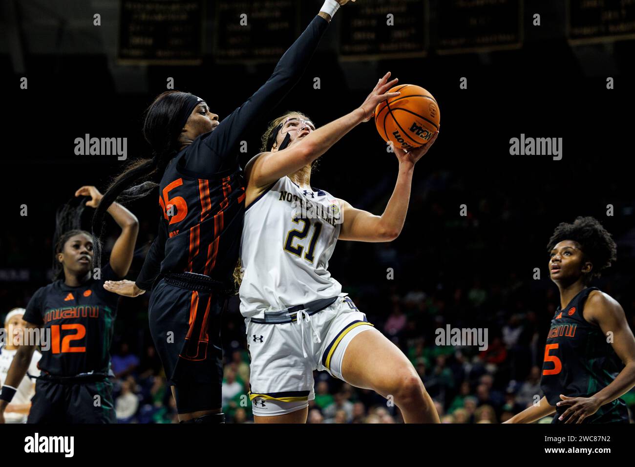 January 14, 2024: Notre Dame forward Maddy Westbeld (21) goes up for a shot as Miami forward ...
