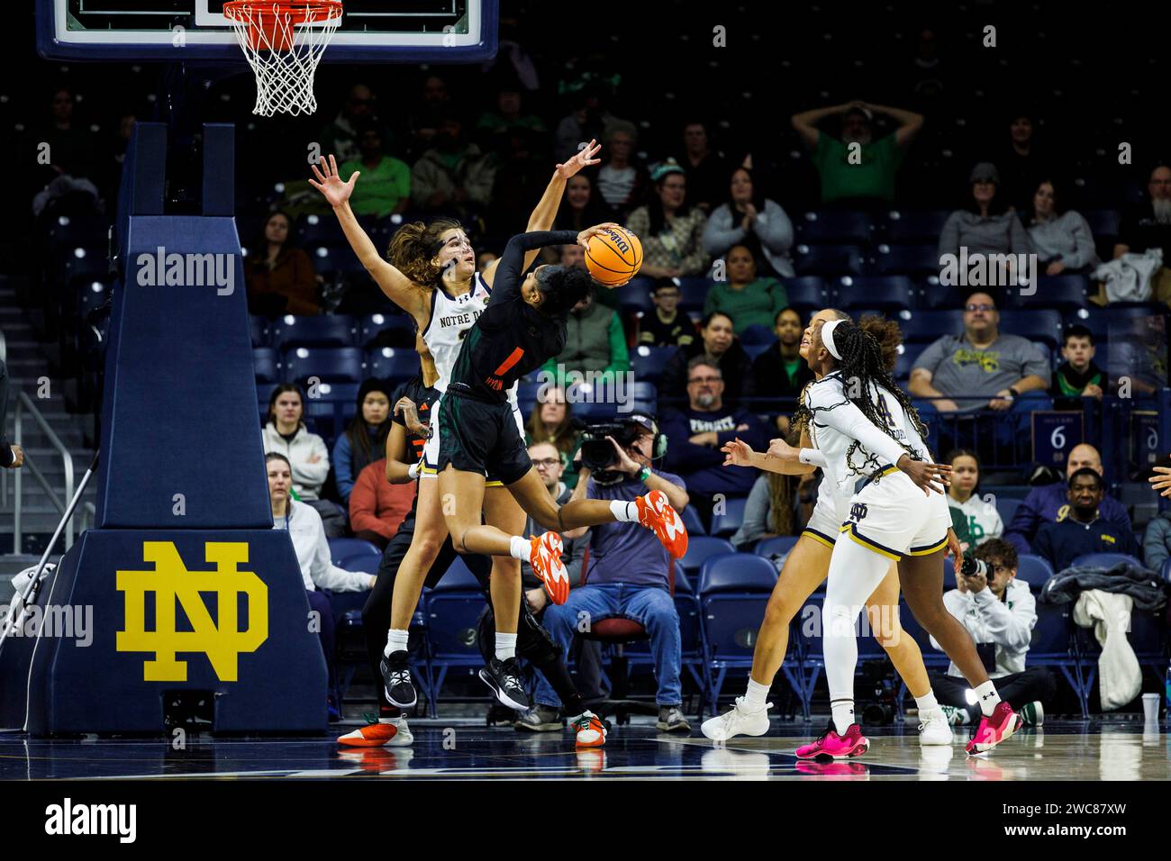South Bend, Indiana, USA. 14th Jan, 2024. Miami guard Lemyah Hylton (1) goes up for a shot as ...