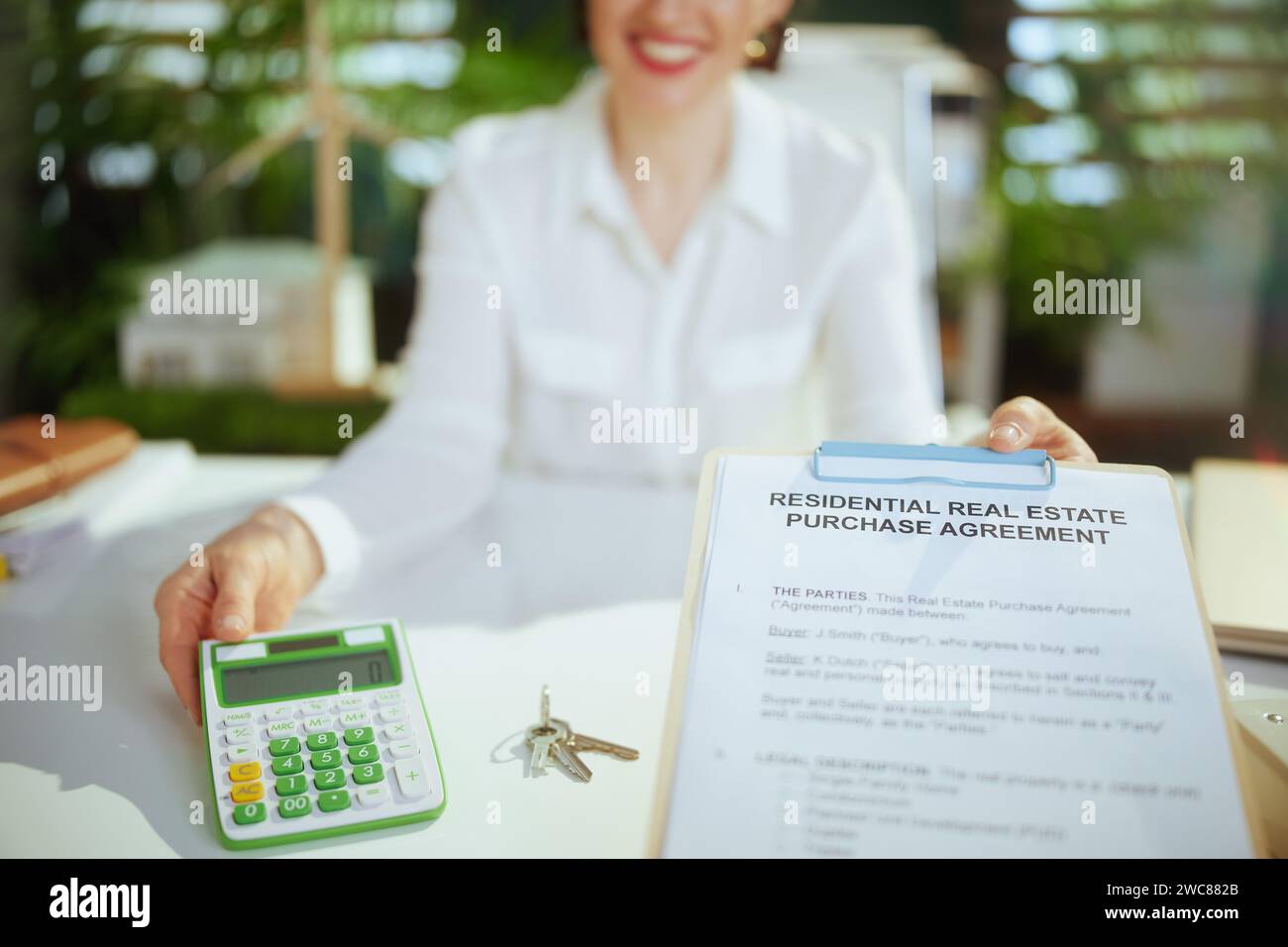 Sustainable real estate business. Closeup on elegant female realtor in ...
