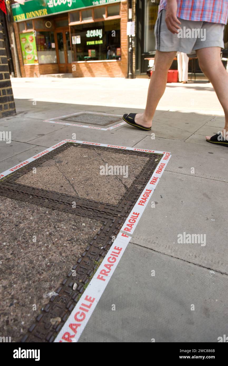 Pavement utility covers hi-res stock photography and images - Alamy