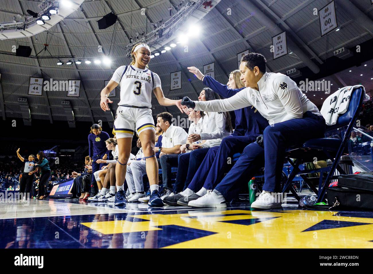 South Bend, Indiana, USA. 14th Jan, 2024. Notre Dame guard Hannah Hidalgo (3) slaps hands with ...