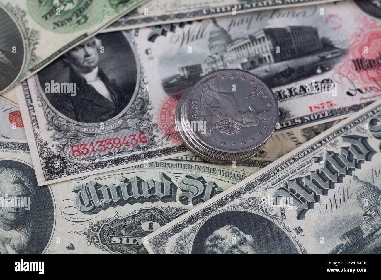 Old west US banknotes with silver dollar coins background Stock Photo ...