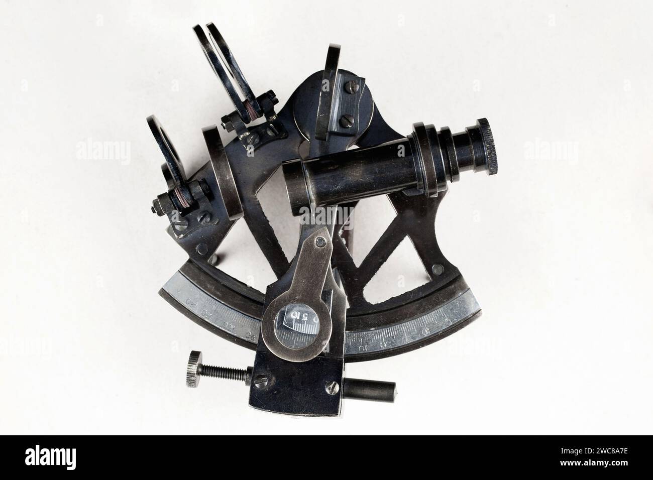 Antique bronze sextant on old paper background Stock Photo - Alamy