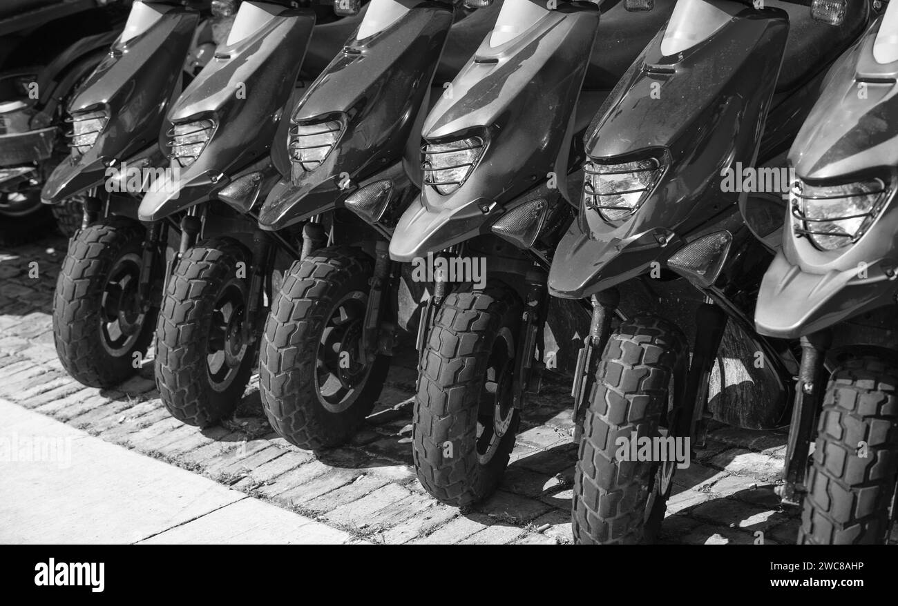 parked rental moped red color with wheel. parked rental moped outdoor ...