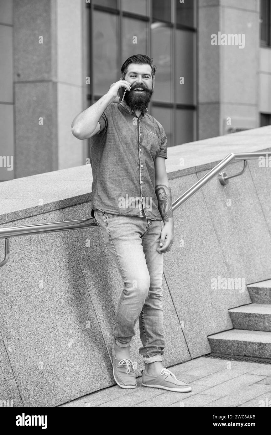 Glad man smartphone call Black and White Stock Photos & Images - Alamy