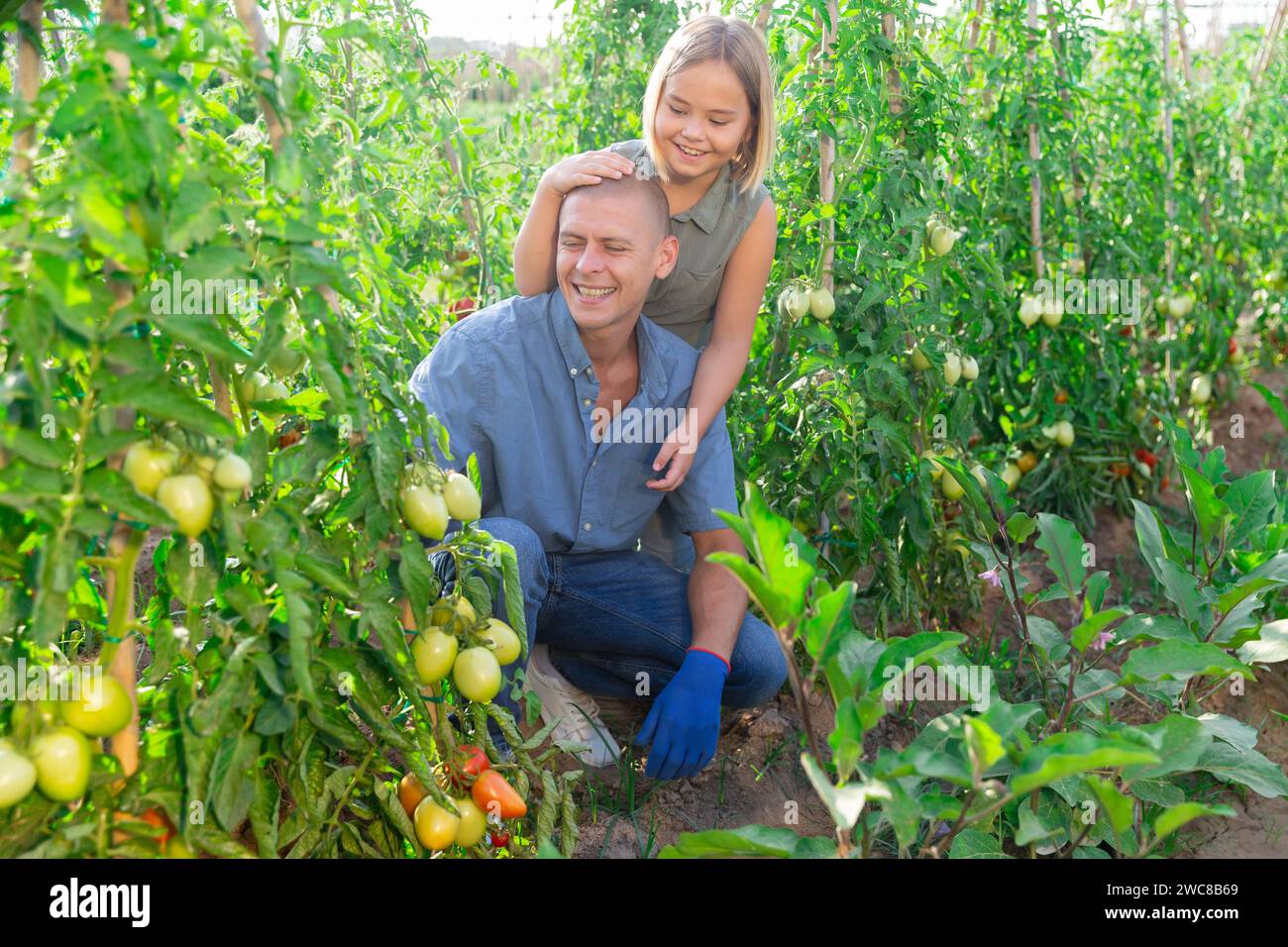 Father and daughter having fun in garden Stock Photo - Alamy