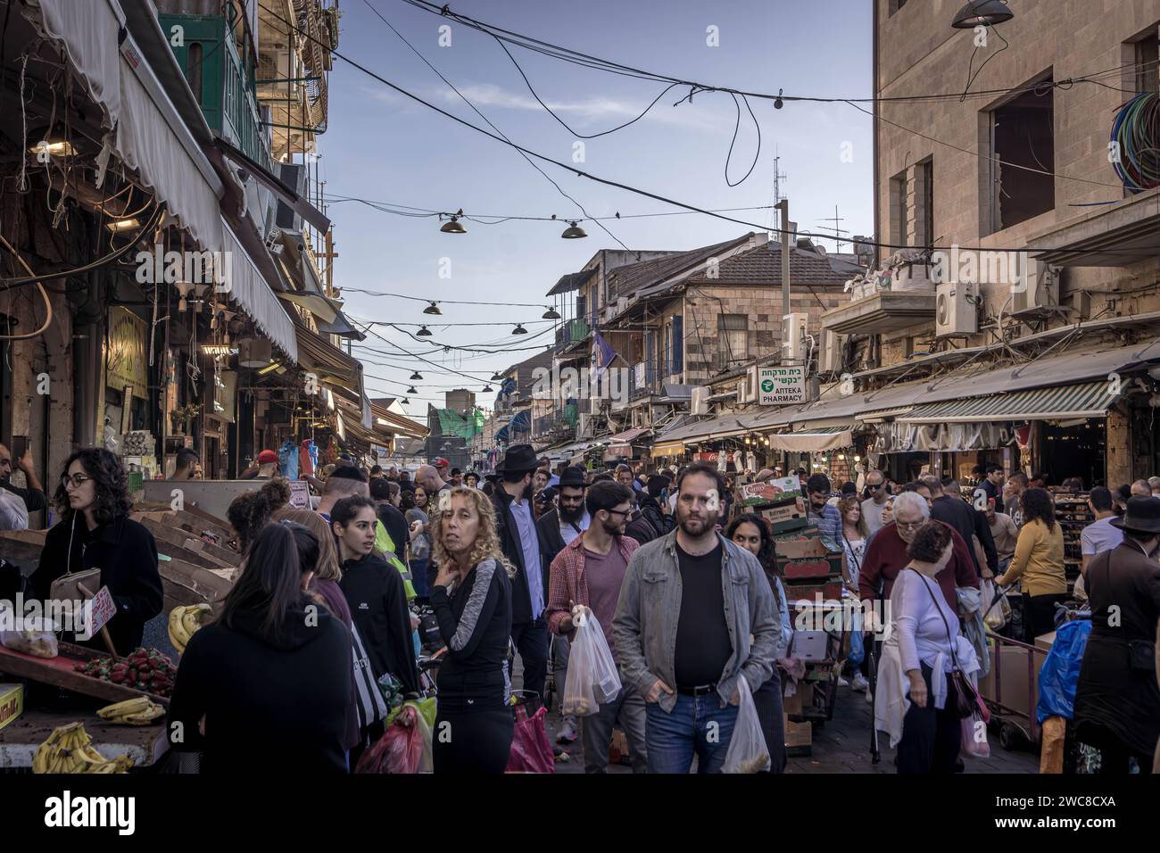 The local Israeli and Arab people, as well as the tourists, are in the ...