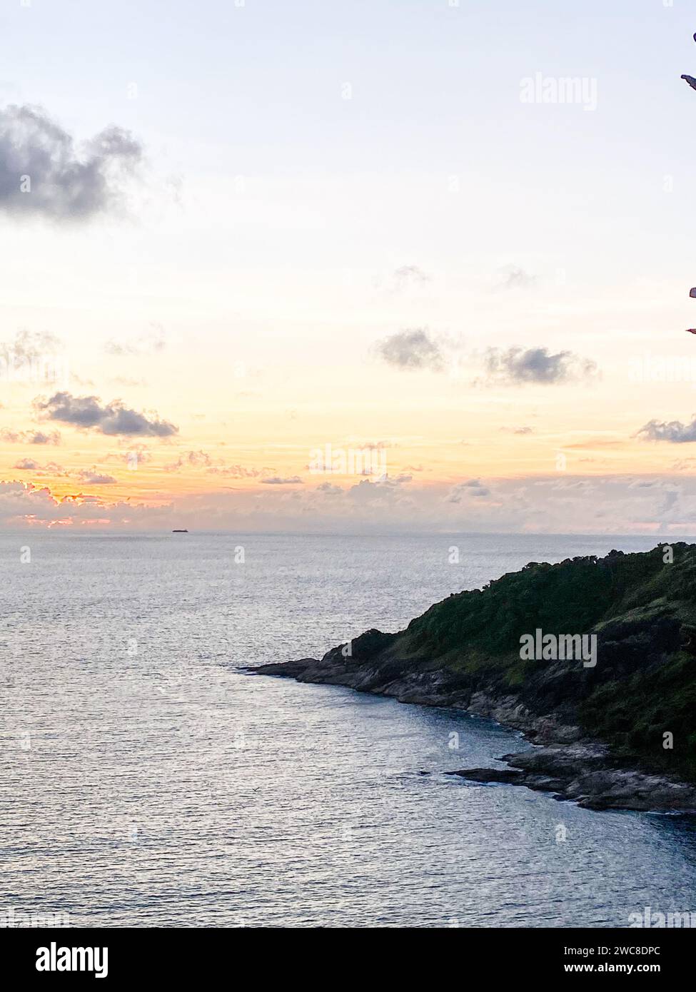 The horizon stretches endlessly, framing a paradise bay where waves ...