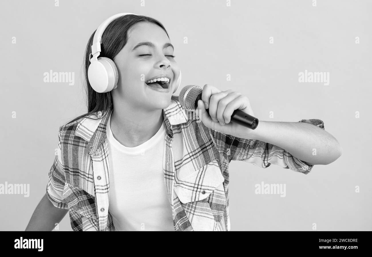 teen girl karaoke singer in headphones on background. photo of teen ...
