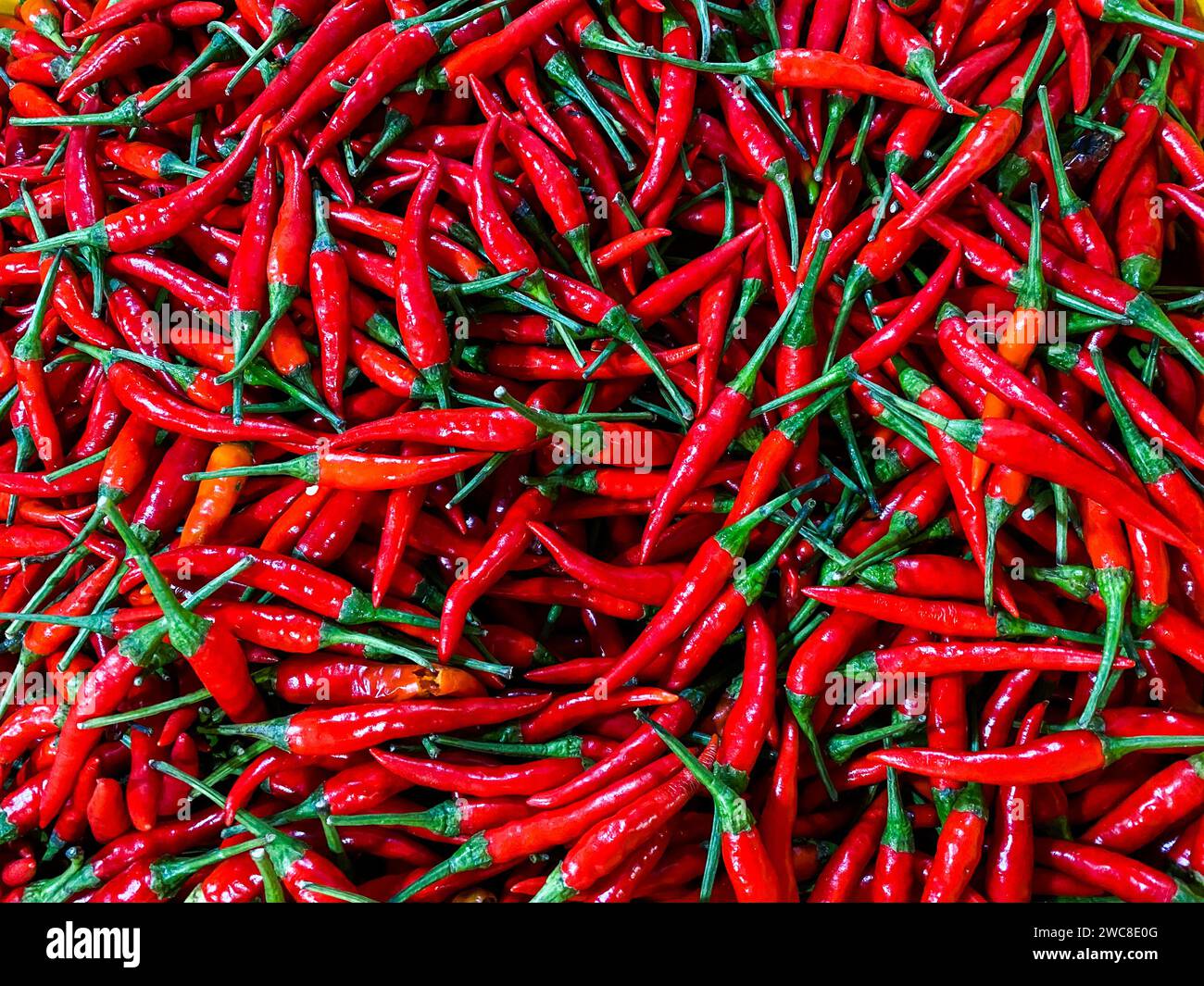 Red hot chilli peppers texture background. Close up view with copy ...