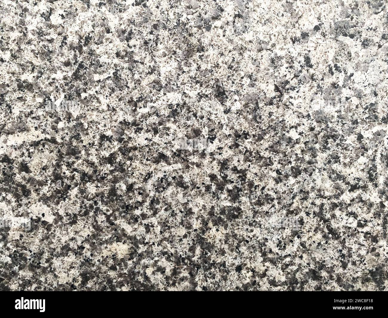 white-painted concrete floor with a crumpled effect, adding texture to ...