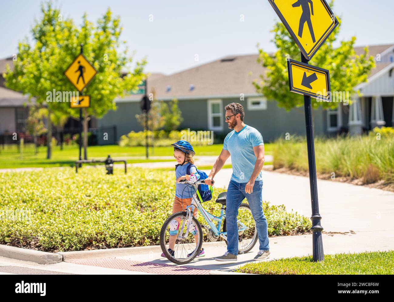 father and son on bicycle at fathers day. active father setting a ...