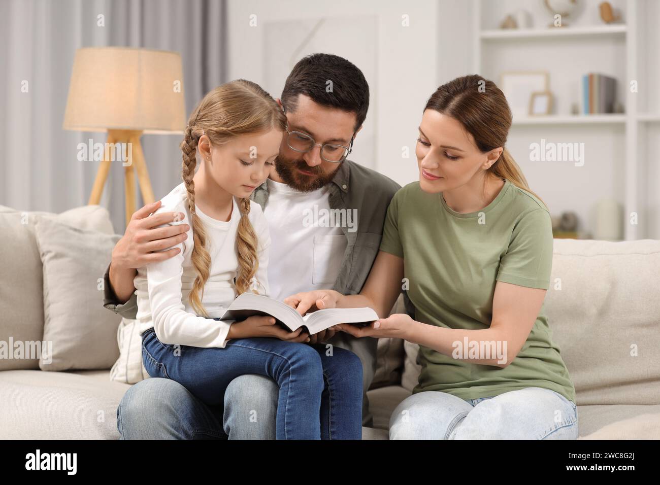 Girl reading holy bible home hi-res stock photography and images - Alamy