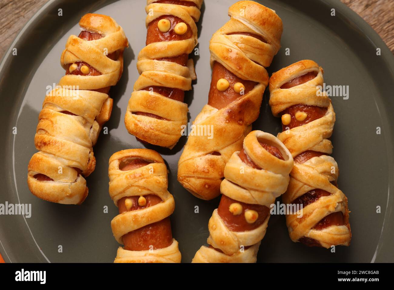 Cute sausage mummies on plate, closeup. Halloween party food Stock ...
