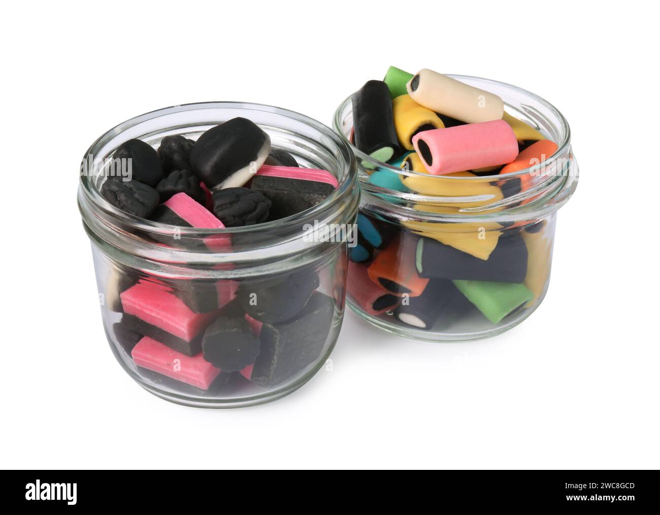 Glass jars of tasty liquorice candies isolated on white Stock Photo - Alamy