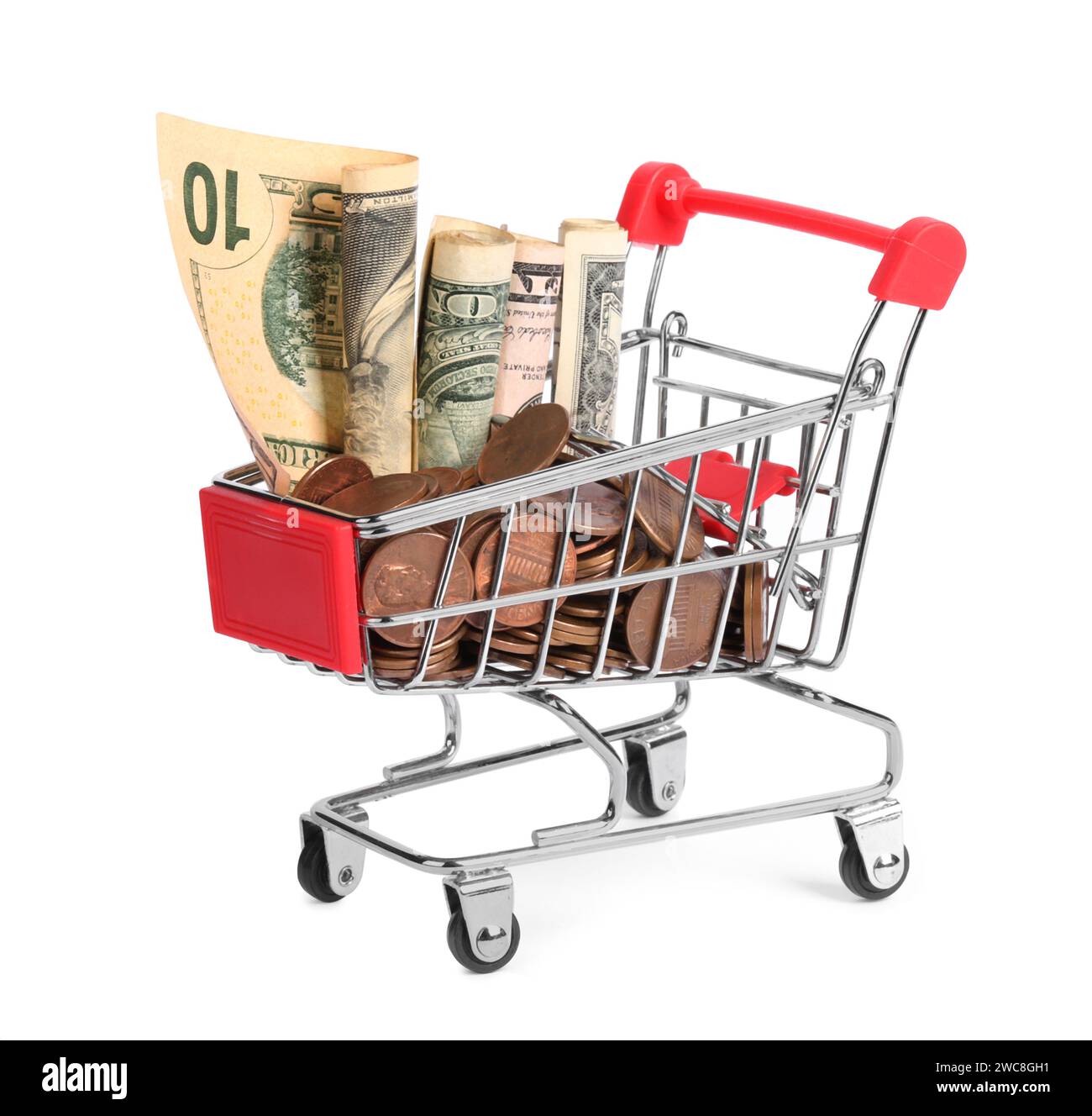 Small metal shopping cart with dollar bills and coins isolated on white ...