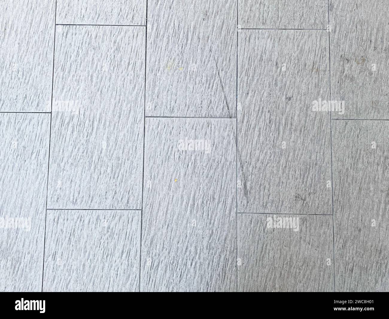 A bright and isolated concrete texture with a crumpled effect, creating ...