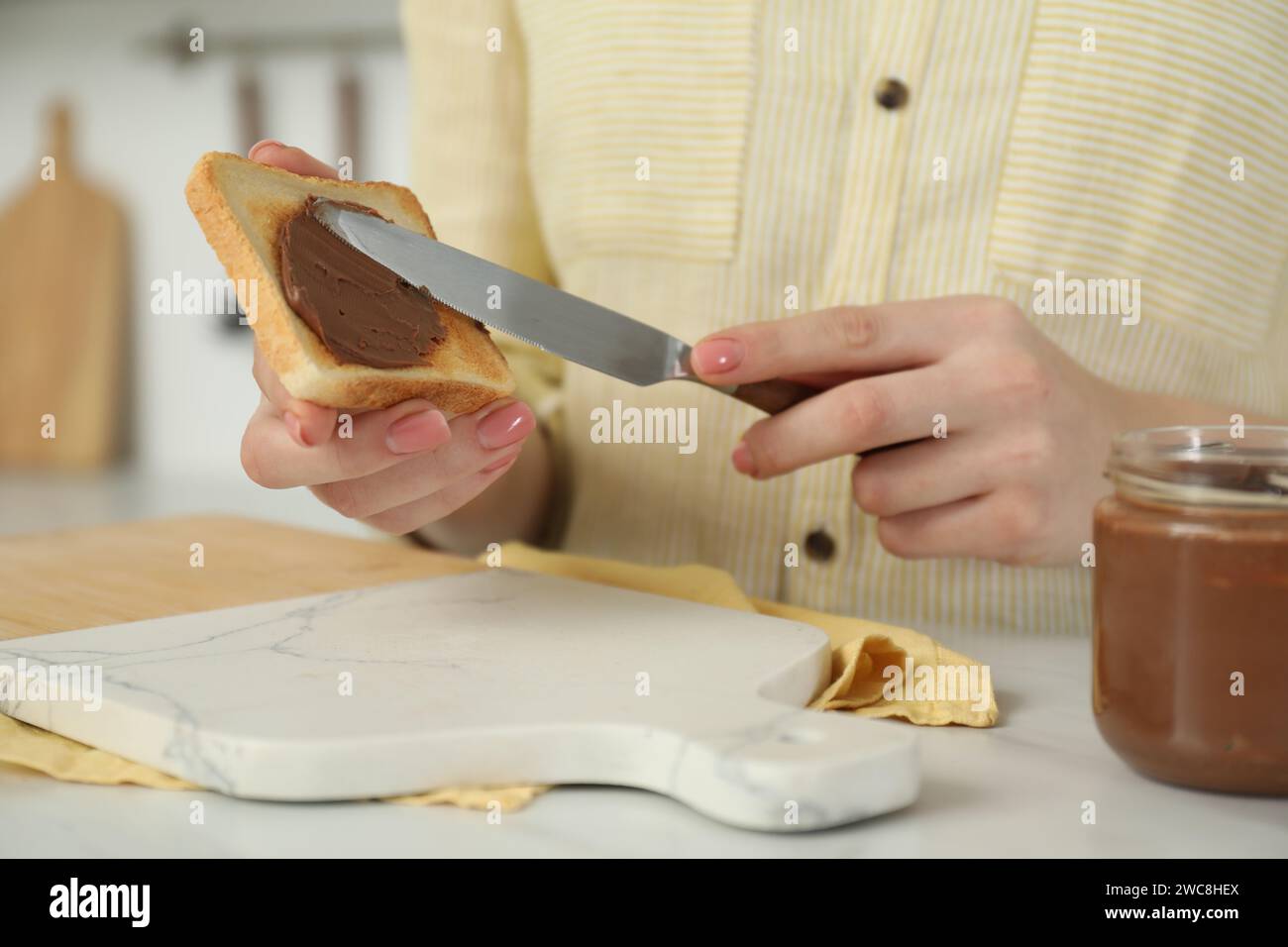 Spreading butter onto toast knife hi-res stock photography and images ...
