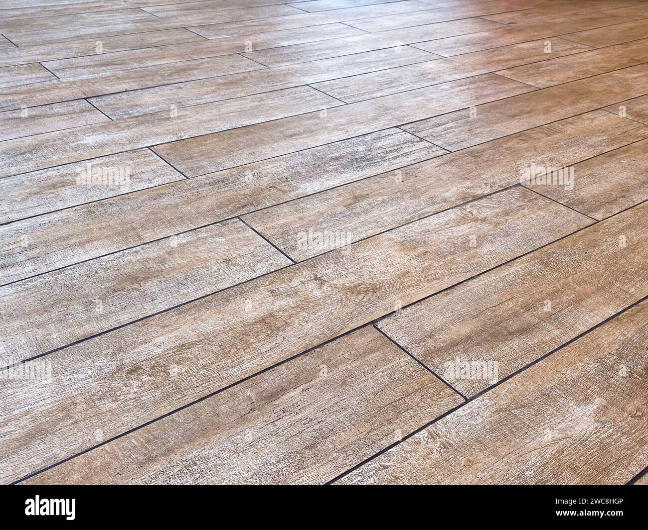 Teak wood with a rough and textured appearance, providing a raw and ...