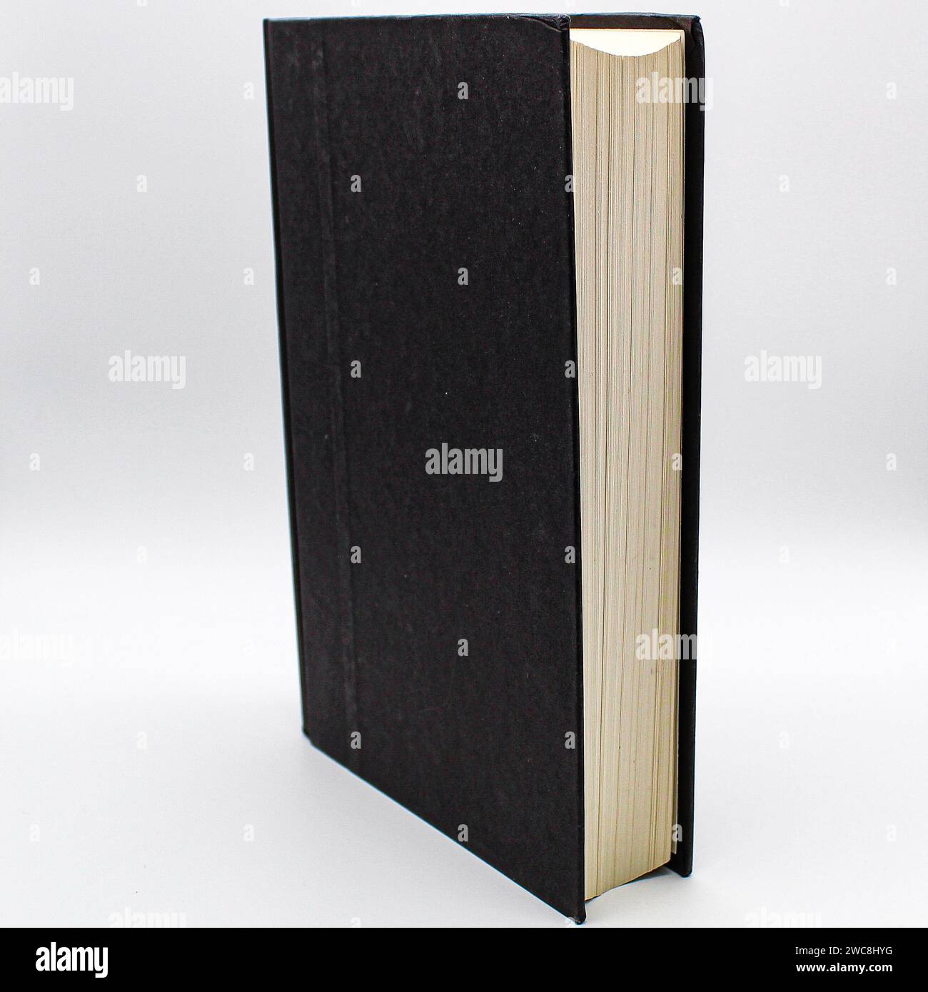 Black book standing Stock Photo - Alamy