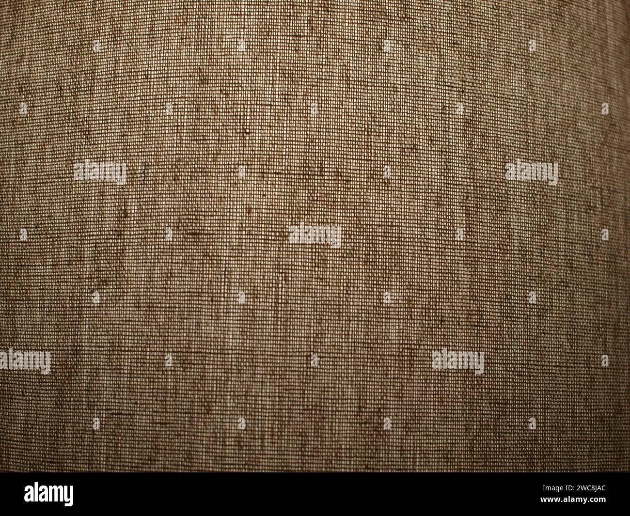 Brown textile texture with a back light. Work as texture or background ...