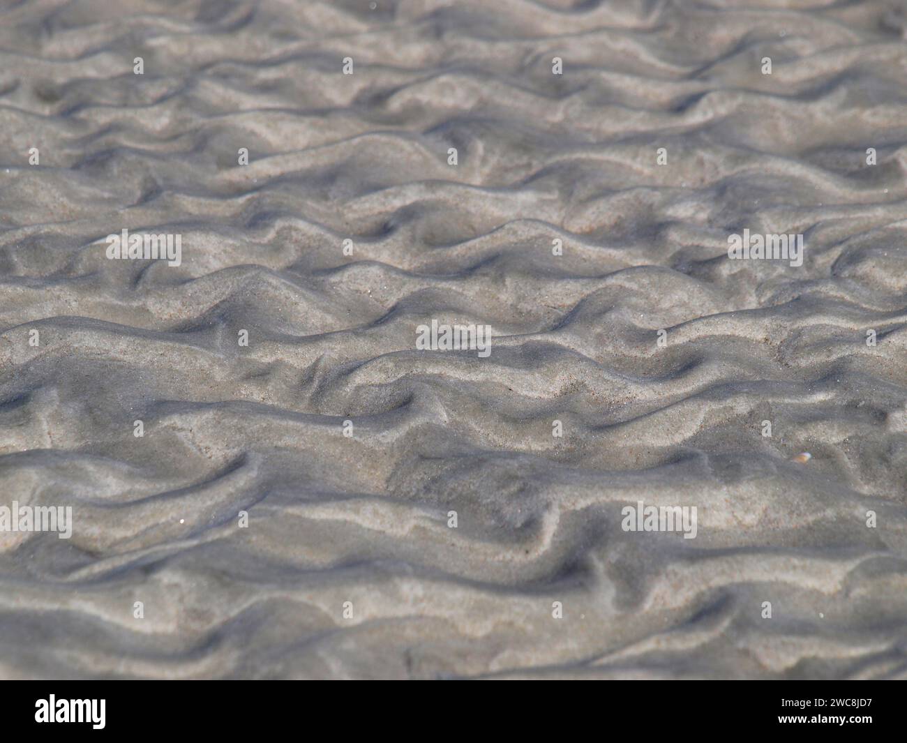 Beach sand texture resembling waves. Tropical beach. Abstract pattern ...
