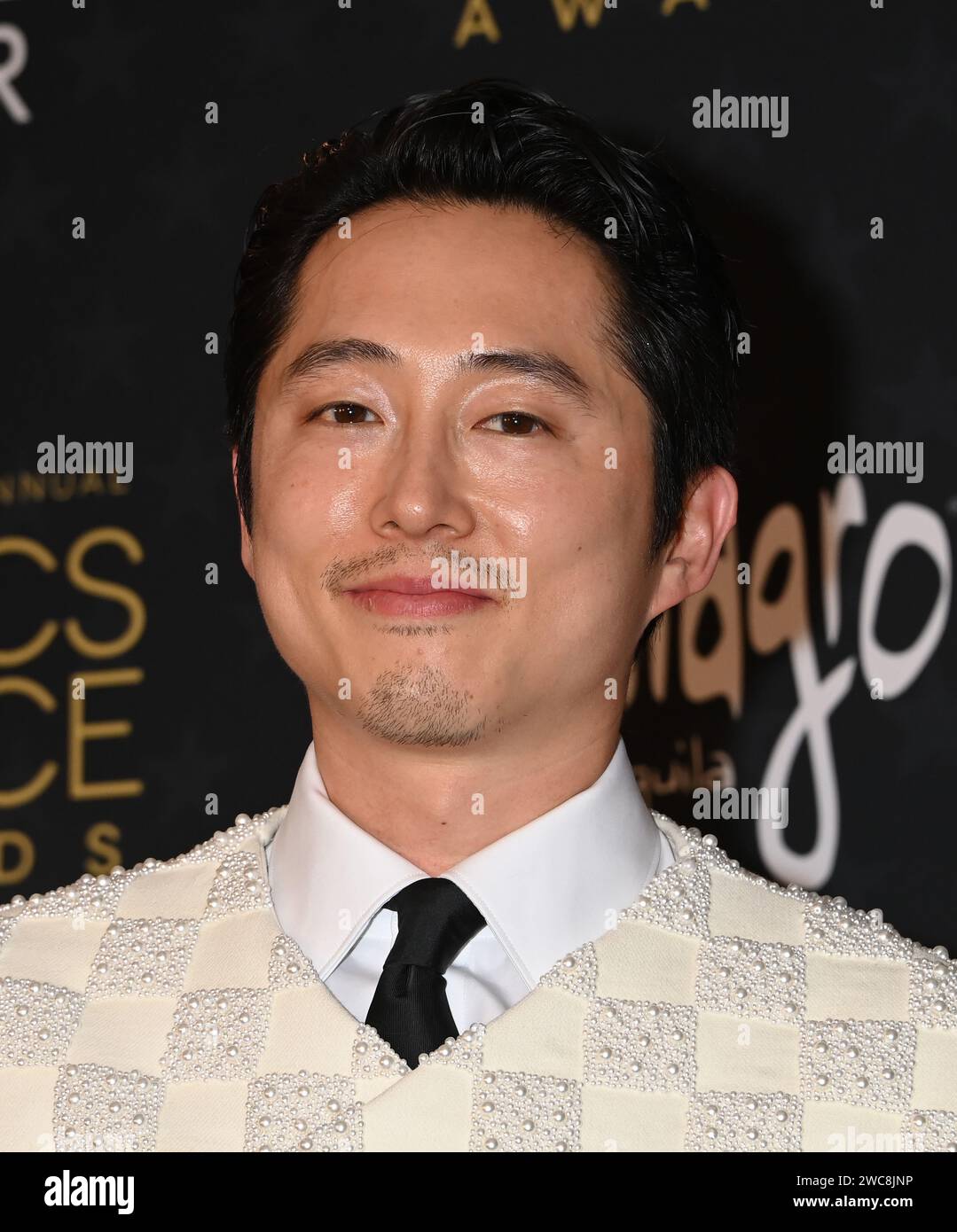 Santa Monica, USA. 14th Jan, 2024. Steven Yeun in the pressroom at the ...