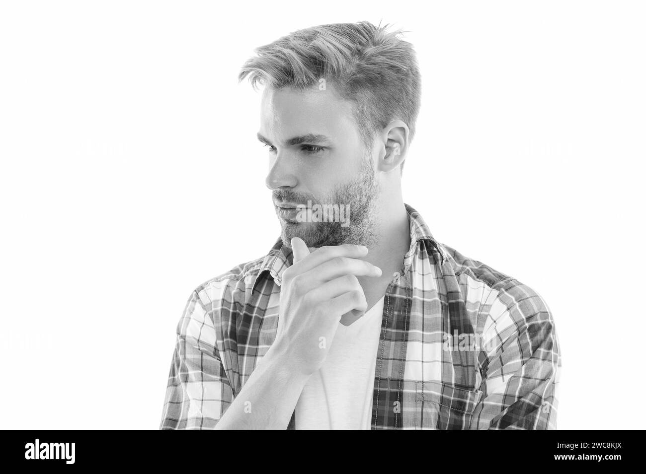 pondering millennial guy on background. millennial guy in studio. photo ...