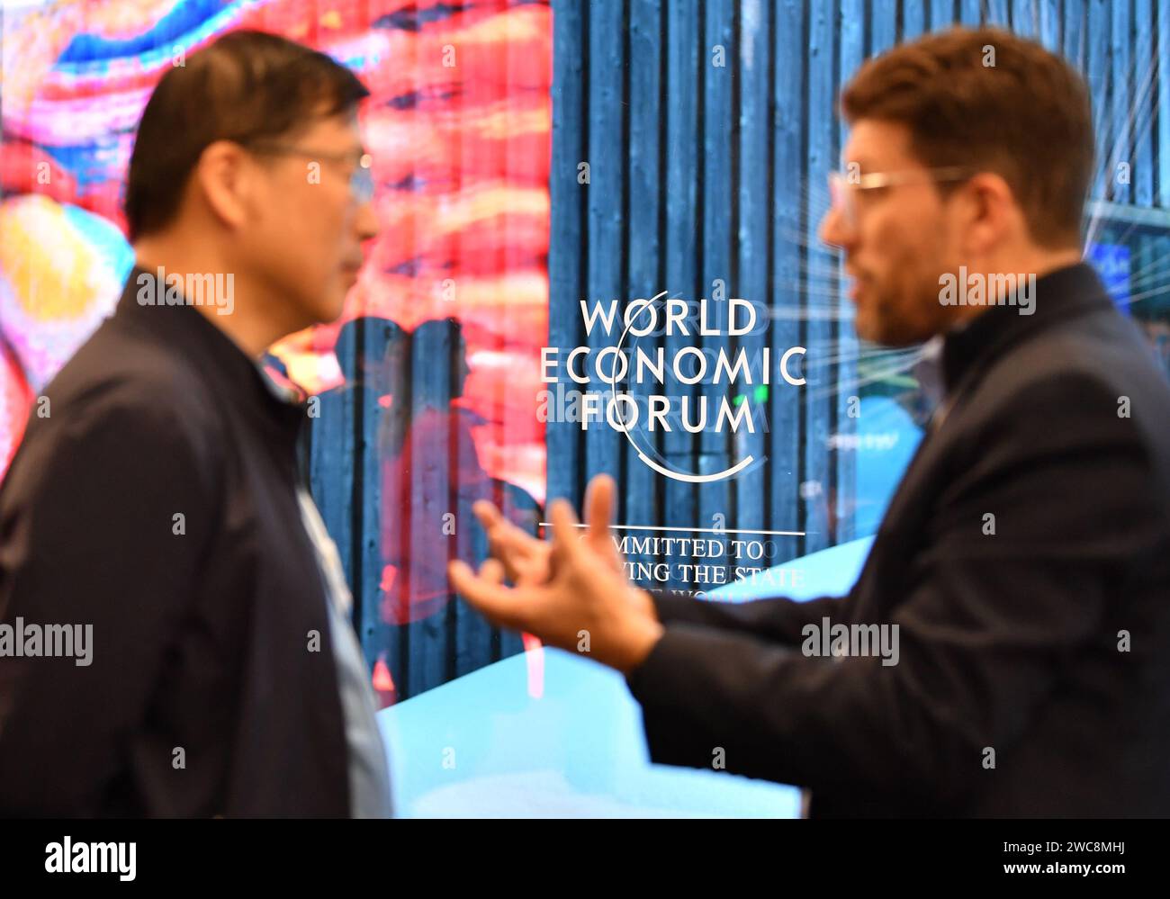 Davos, Switzerland. 14th Jan, 2024. People talk at the Congress Center ...