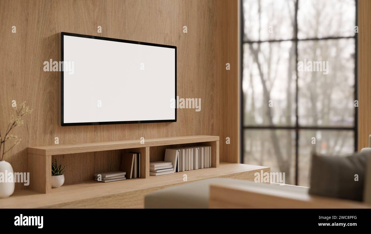 A modern white TV monitor mockup on a wooden wall above a wooden ...