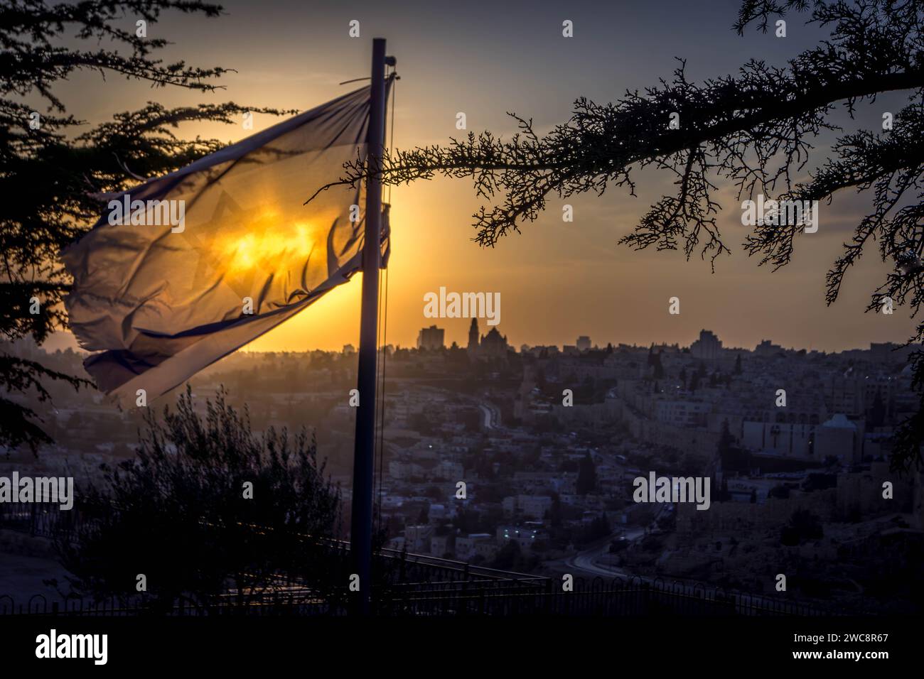 The Israeli flag (flag of Israel), the national symbol, is waving with ...