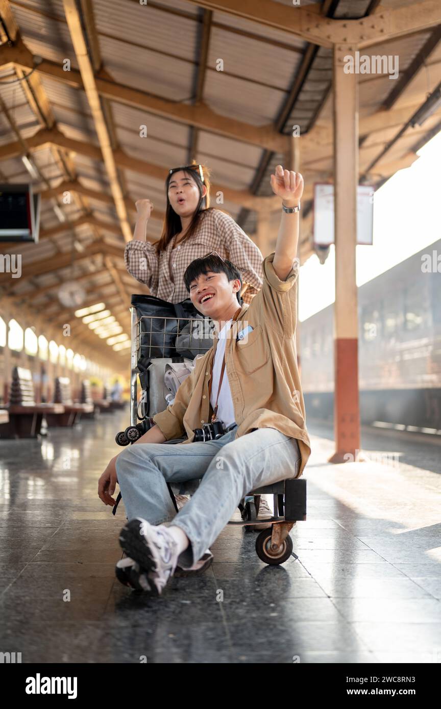 Lovely and carefree young Asian couple are excited for their summer ...