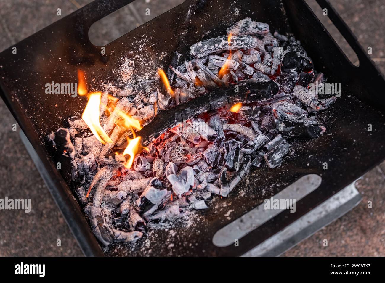 Close up of campfire, fire pit filled with burnt wood and flames. Fire ...
