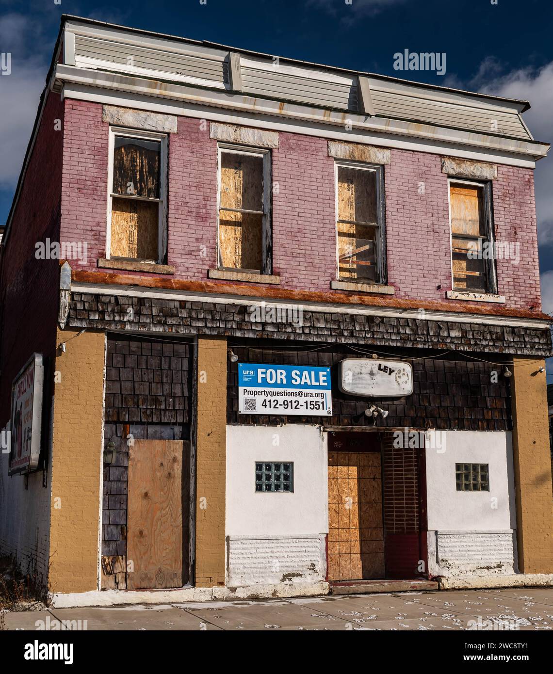 A former bar and apartment, now abandoned and boarded up on Hamilton ...