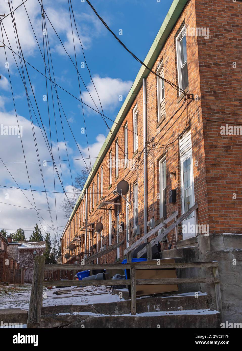 A set of row houses with power lines connected to them in Swissvale ...