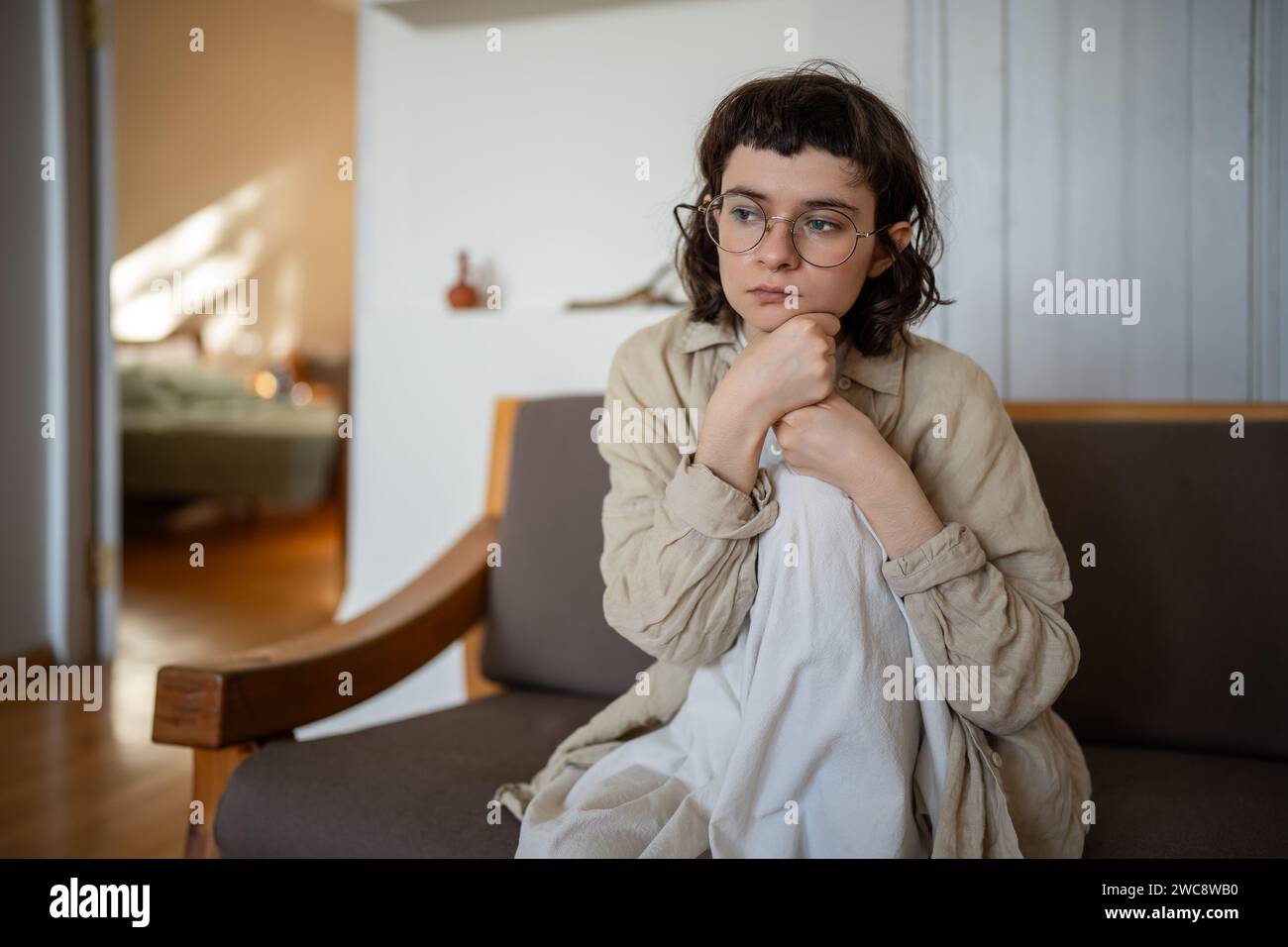 Thoughtful bored lonely teen girl in glasses feeling apathy sadly ...