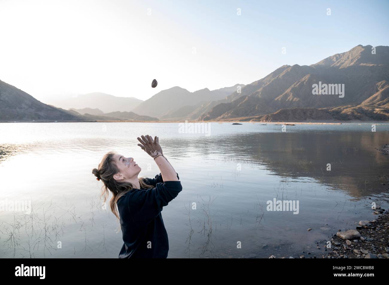Putting mud on face hi-res stock photography and images - Alamy