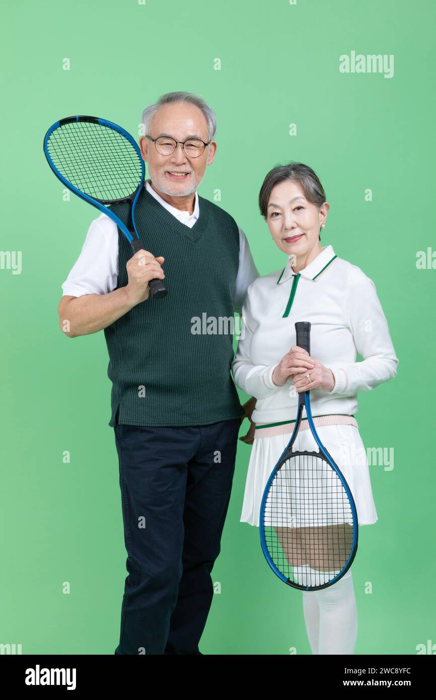 A senior with a tennis racket Stock Photo - Alamy